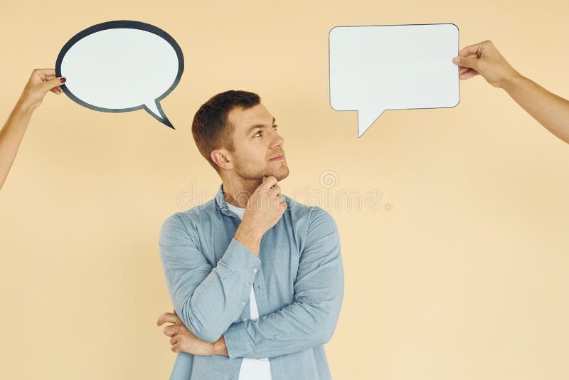 Different Thoughts. Man Standing in the Studio with Empty Signs for the ...