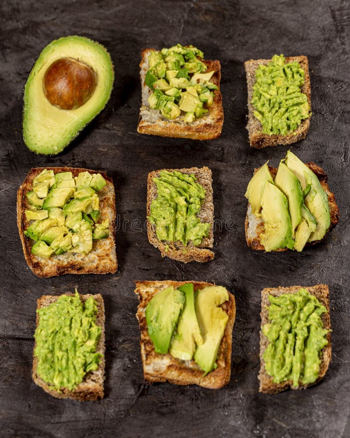 Different Toasts with Avocado on Dark Background Stock Image - Image of ...
