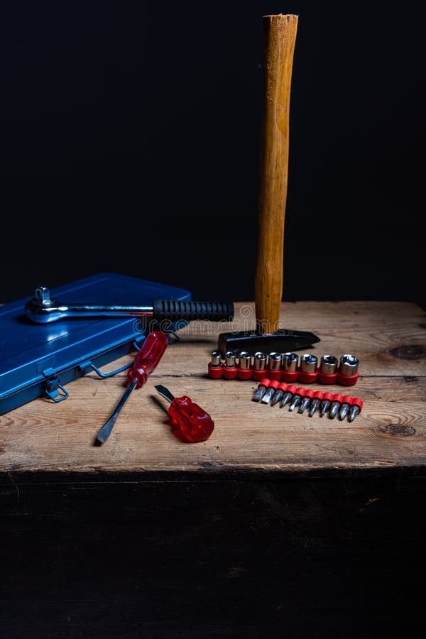 Different Tools and a Blue Tool Box on a Wooden Surface Stock Photo ...