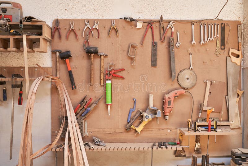 Different Tools Hang on a Wall Stock Photo - Image of middle, workbench ...
