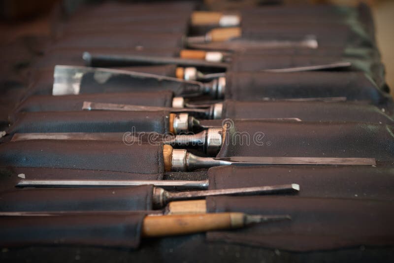 Gouges and Chisels in the Foreground Leather Case Stock Image - Image ...