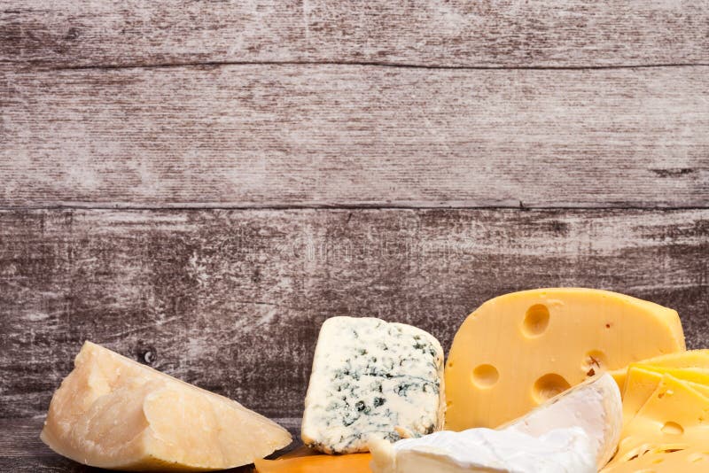 Different Type of Cheese on Wooden Background Stock Photo - Image of ...