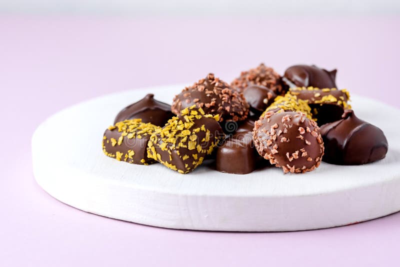 Different Type of Chocolate Candies on Pink Background Tasty Chocolate ... Different Type of Chocolate Candies on Pink Background Tasty Chocolate ...