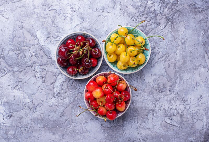 Different Type of Colorful Cherries Stock Image - Image of three, table ...