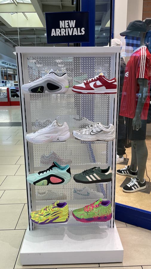 Different Type of Sneakers Showcased in Front of the Store in a Mall ...
