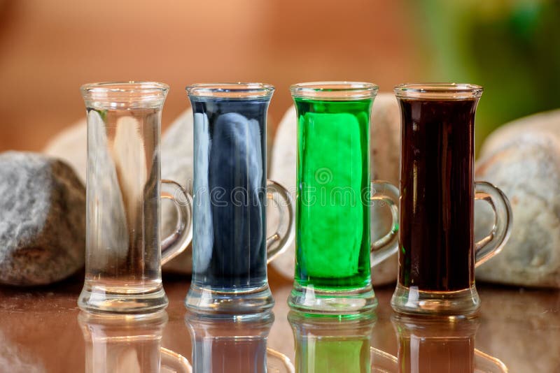 Multi-colored Alcohol in Shots on a Background of Stones. Stock Photo ...