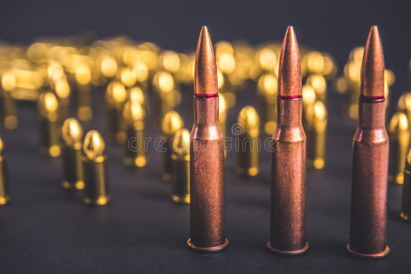 Different Types of Ammunition on Dark Stone. Blur Bullets Backround ...