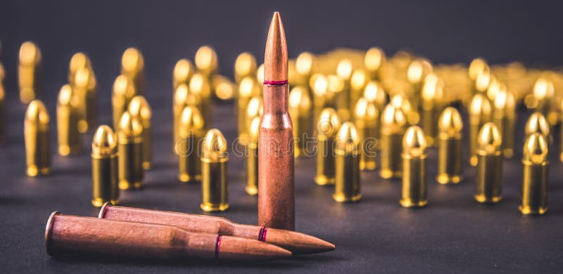 Different Types of Ammunition on Dark Stone. Blur Bullets Backround ...