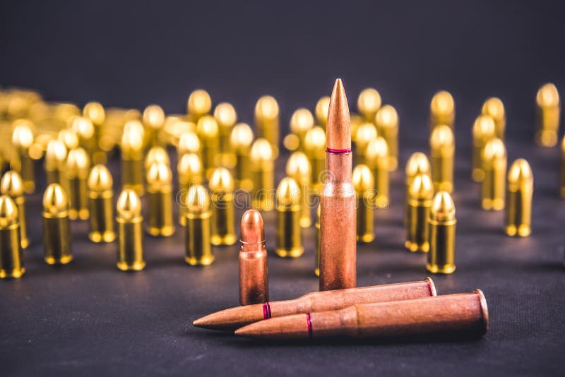 Different Types of Ammunition on Dark Stone. Blur Bullets Backround ...