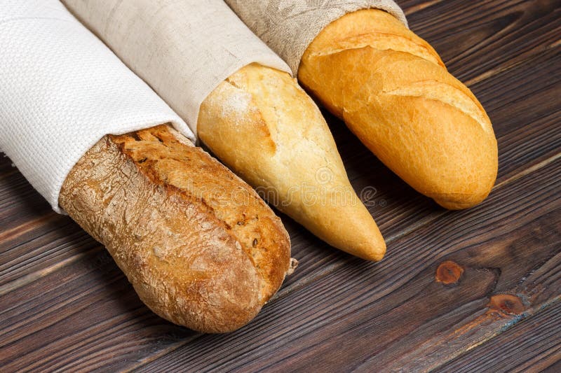 Different Types of Baguette on a Wooden Background Stock Image - Image ...