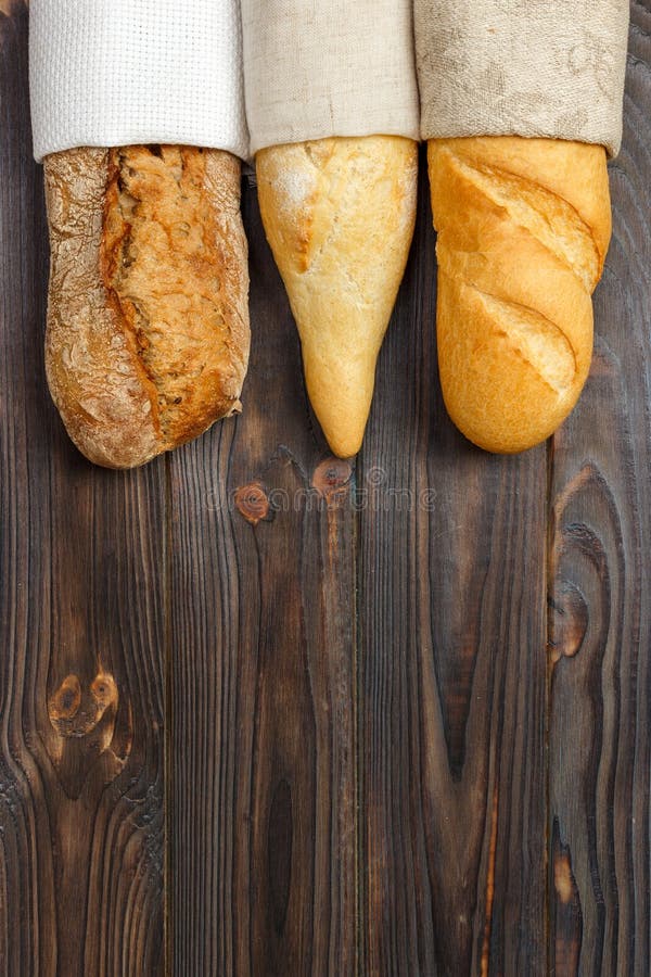 Different Types of Baguette on a Wooden Background Stock Image - Image ...