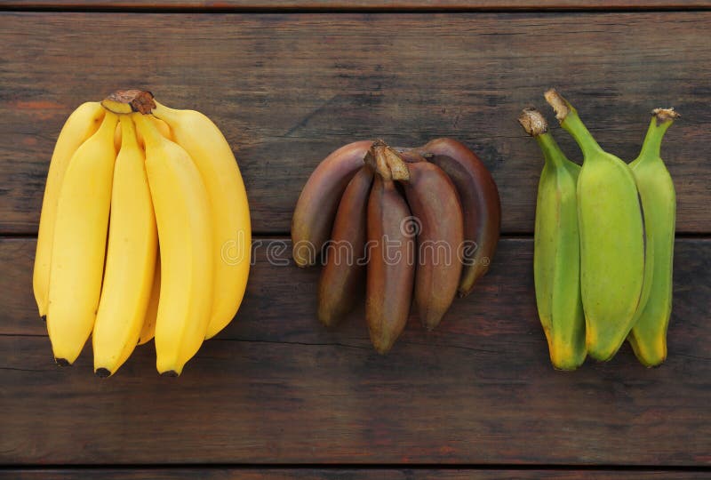 Different Types of Bananas on Wooden Table, Flat Lay Stock Image ...