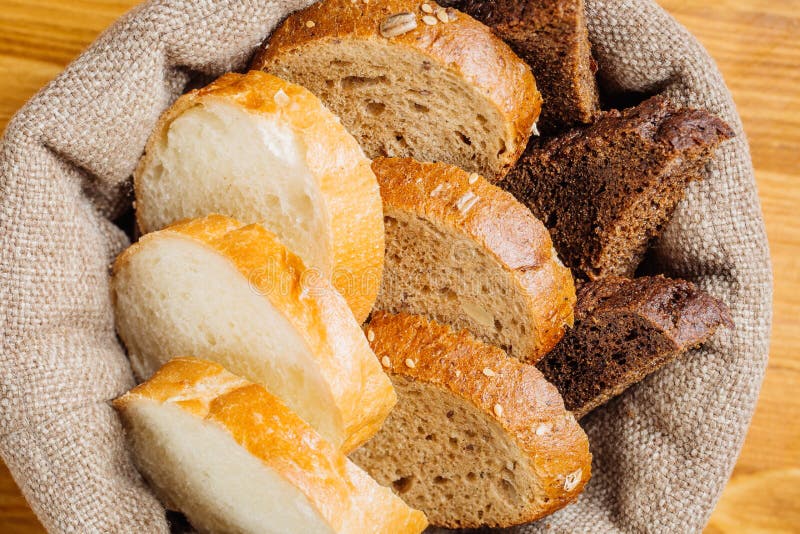 Different Types of Bread in the Basket on the Table Stock Image - Image ...