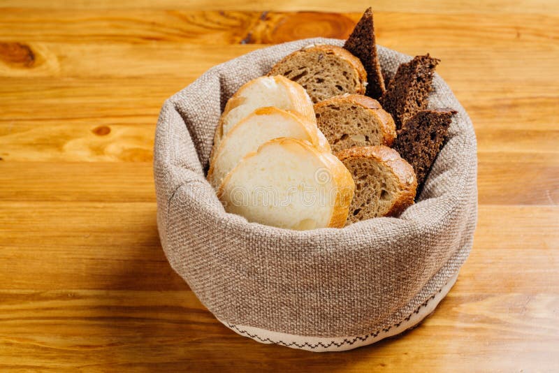 Different Types of Bread in the Basket on the Table Stock Photo - Image ...