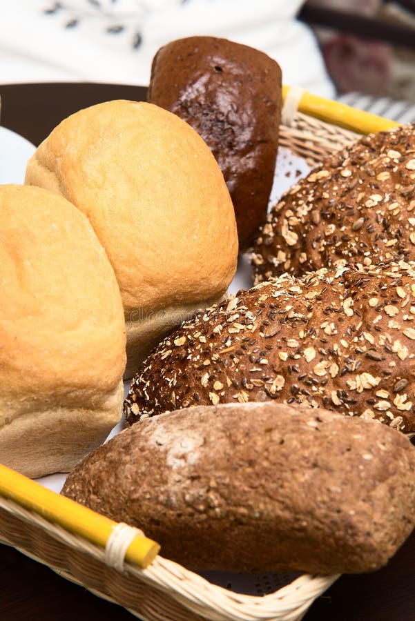 Different Types of Bread in the Basket. Wheat, Rye Bread with Bran ...