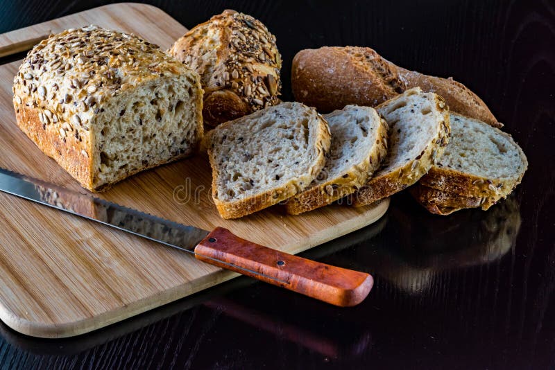 Different Types of Bread Cut into Slices and Whole Stock Photo - Image ...