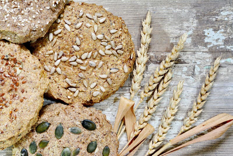 Different Types of Bread, Flour and Wheat on a Wooden Table. Stock ...
