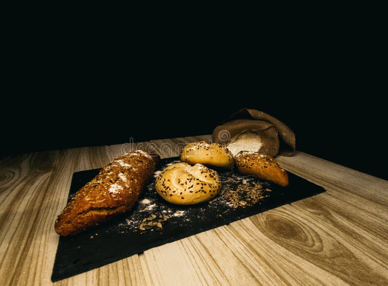 Different Types of Bread on a Slate Board Stock Photo - Image of ...