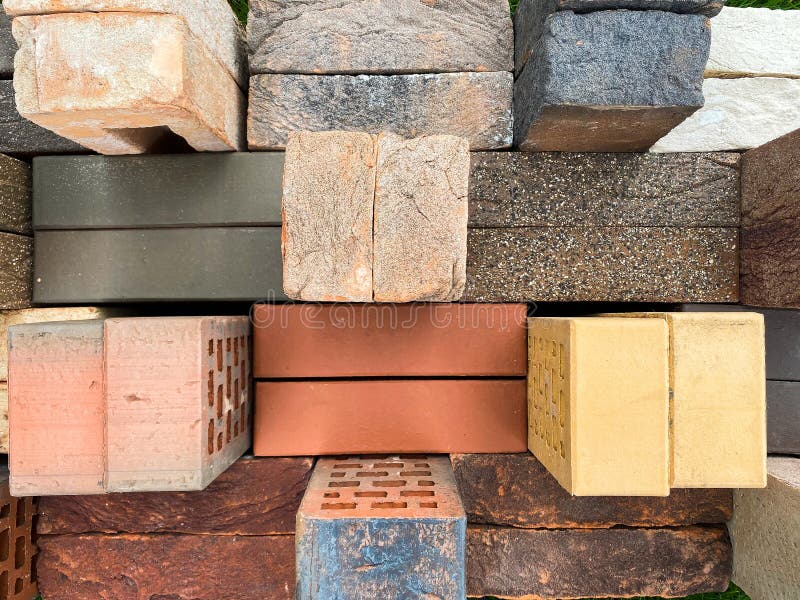 Different Types of Bricks Stacked Beautifully on Green Grass Stock ...