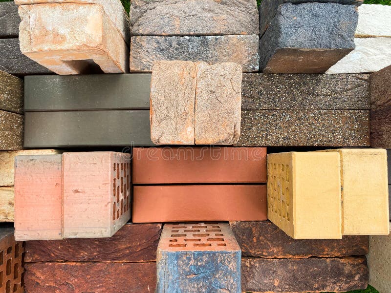 Different Types of Bricks Stacked Beautifully on Green Grass. Top View ...