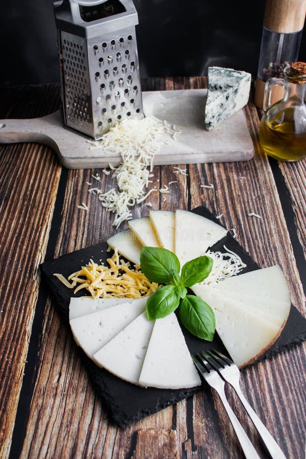 Different Types of Cheese. Italian Cuisine. Wooden Background Stock ...