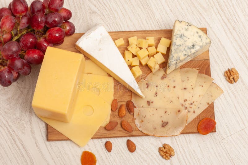 Different Types of Cheese on a Wooden Board. Top View Stock Image ...