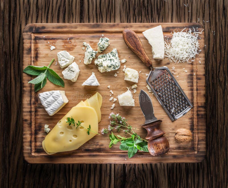Different Types of Cheeses with Nuts and Herbs. Stock Photo - Image of ...