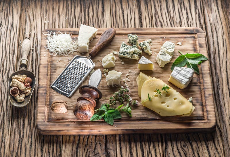 Different Types of Cheeses with Nuts and Herbs. Stock Image - Image of ...