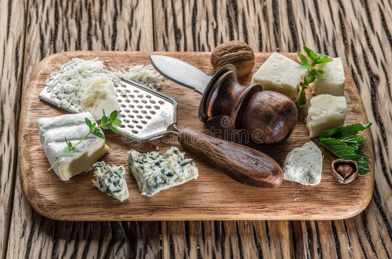 Different Types of Cheeses with Nuts and Herbs. Stock Image - Image of ...