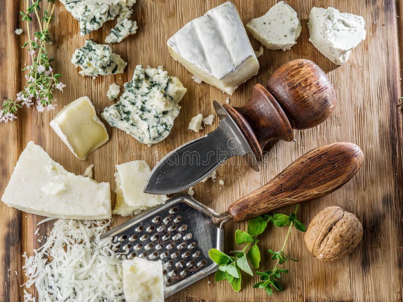 Different Types of Cheeses with Nuts and Herbs. Stock Image - Image of ...
