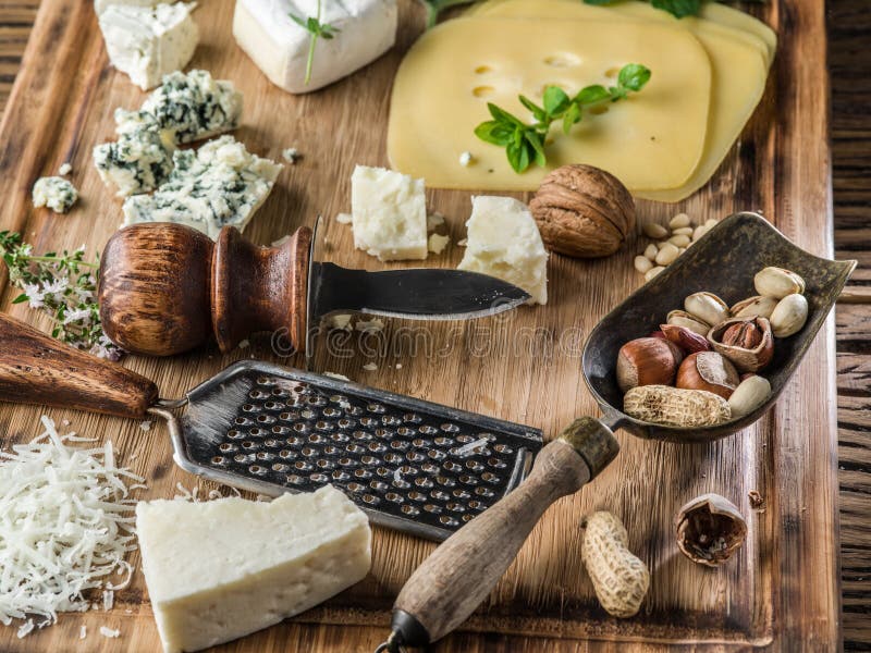 Different Types of Cheeses with Nuts and Herbs. Stock Image - Image of ...