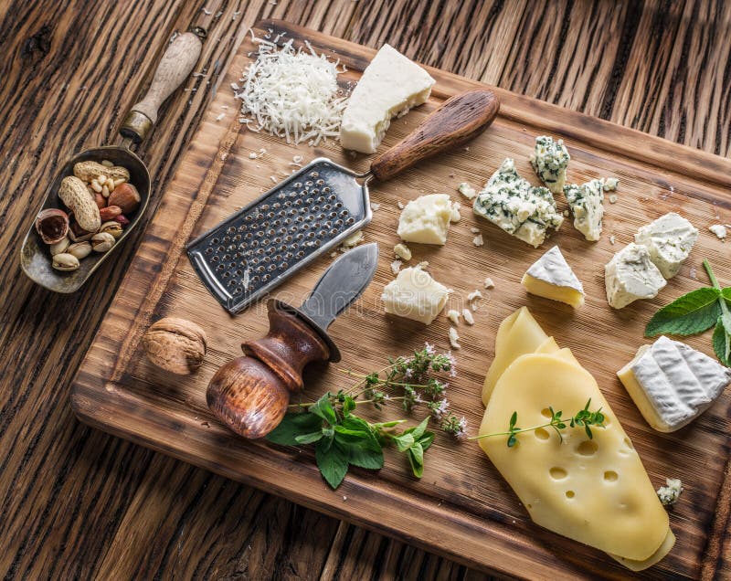 Different Types of Cheeses with Nuts and Herbs. Stock Image - Image of ...