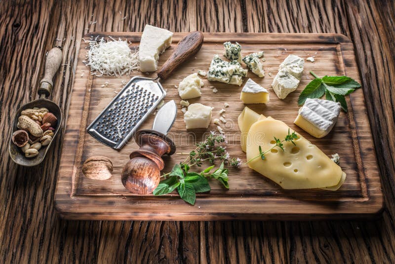 Different Types of Cheeses with Nuts and Herbs. Stock Image - Image of ...