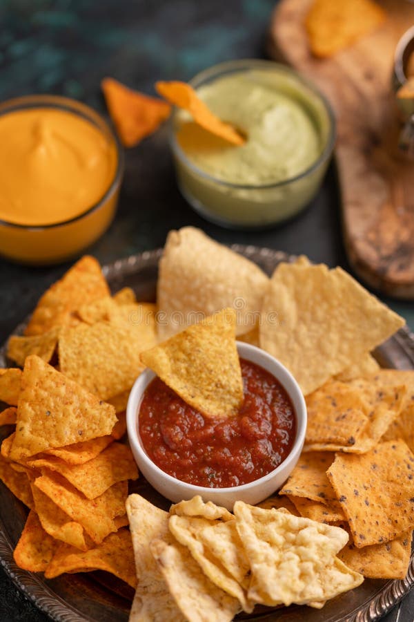 Different Types of Chips with Dressings and Dip and Salsa, Close-up ...