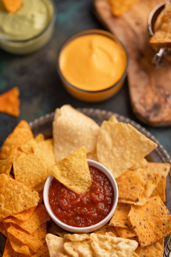 Different Types of Chips with Dressings and Dip and Salsa, Close-up ...