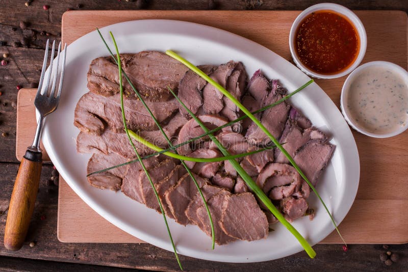 Different Types of Cooked Meat with Hot Sauces on Wooden Table Stock ...