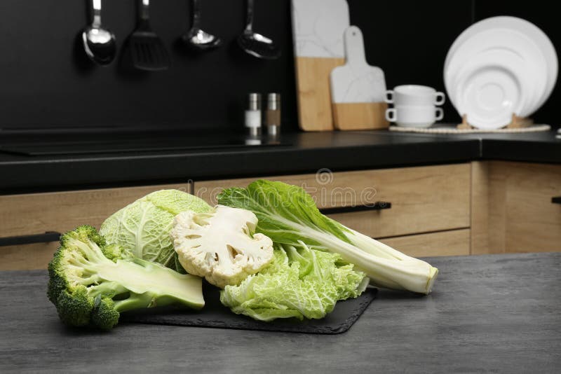 Different Types of Cut Cabbage on Grey Table in Kitchen Stock Image ...