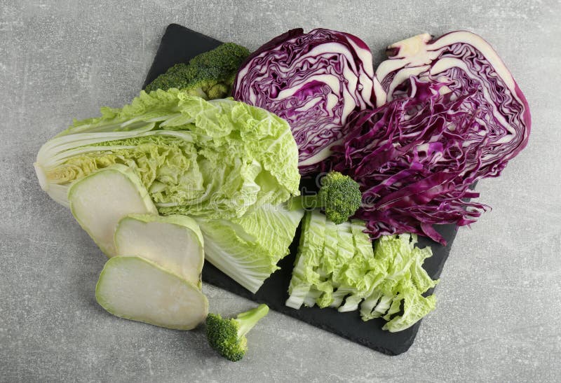 Different Types of Cut Cabbage on Light Grey Table, Flat Lay Stock ...