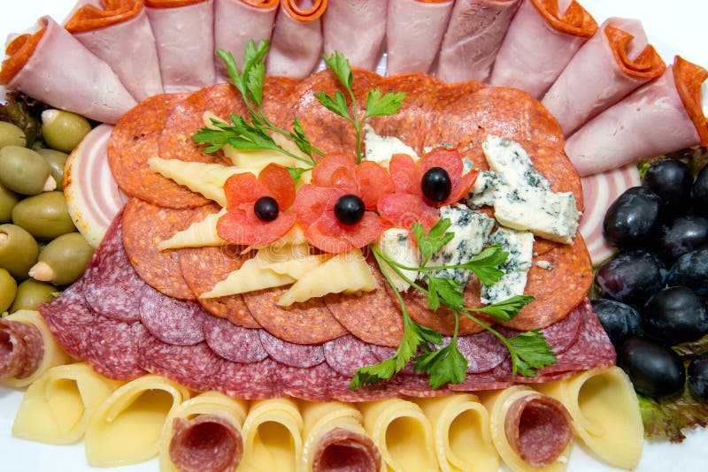 Different Types Delicacies of Meat and Cheese Arranged in a Plate Over ...