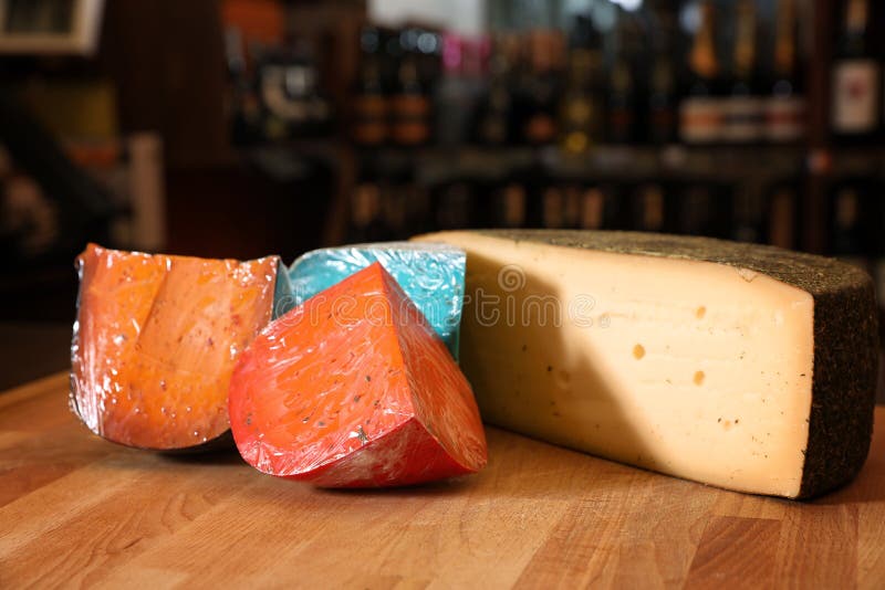 Different Types of Delicious Cheeses on Counter Stock Photo - Image of ...
