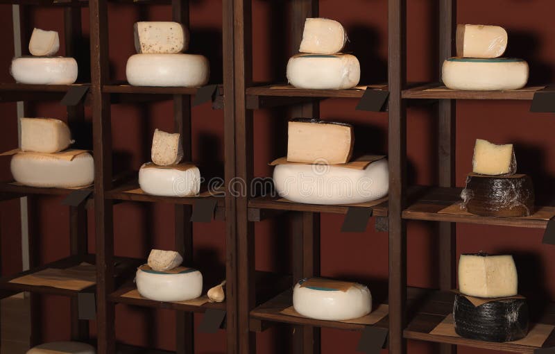 Different Types of Delicious Cheeses on Rack Stock Photo - Image of ...