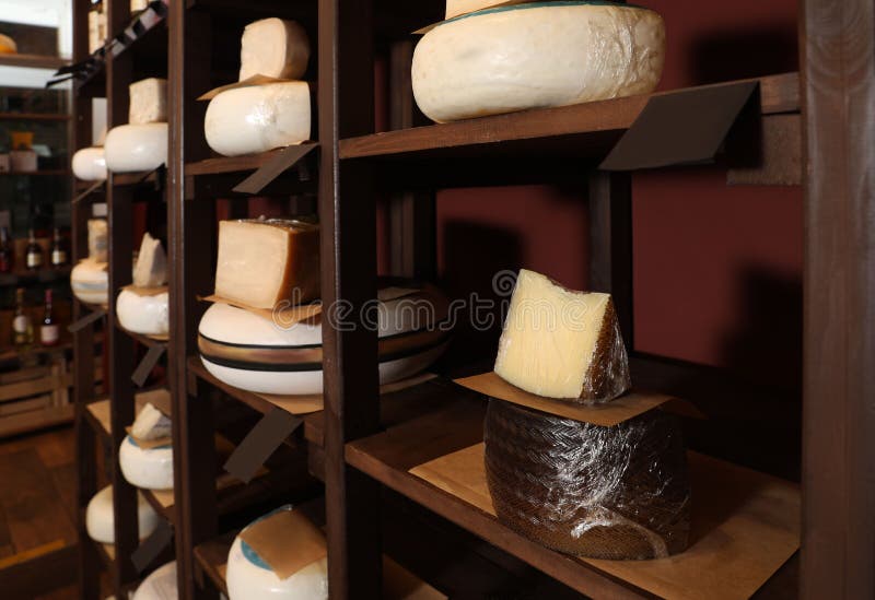 Different Types of Delicious Cheeses on Rack Stock Image - Image of ...