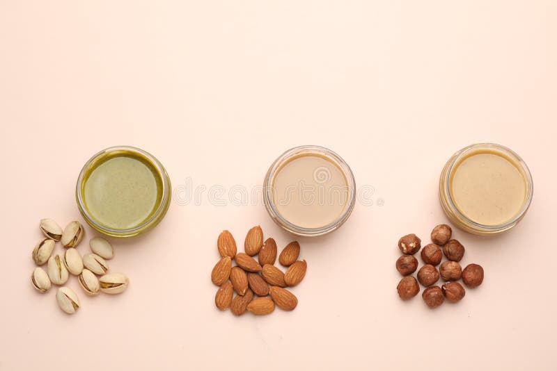 Different Types of Delicious Nut Butters and Ingredients on Beige ...