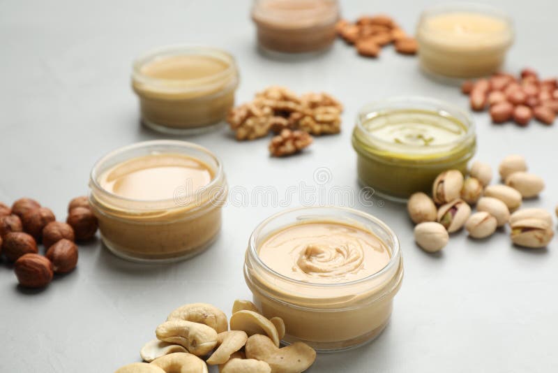 Different Types of Delicious Nut Butters and Ingredients on Light Table ...