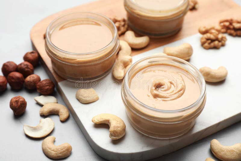 Different Types of Delicious Nut Butters and Ingredients on Light Table ...