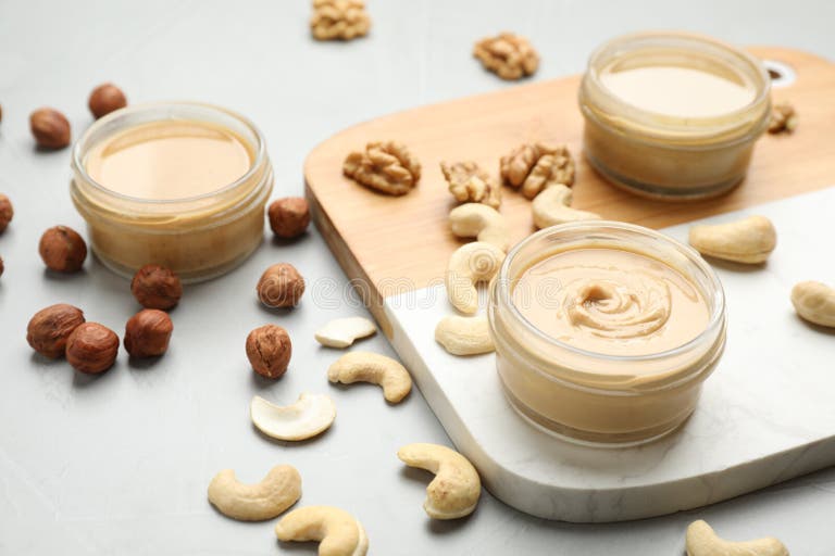 Different Types of Delicious Nut Butters and Ingredients on Light Table ...