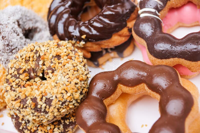 Different Types Of Doughnuts Stock Photo - Image of pink, frosted ...