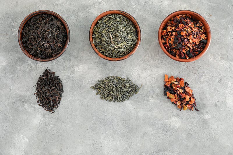 Different Types of Dry Tea Leaves on Grey Background Stock Photo ...