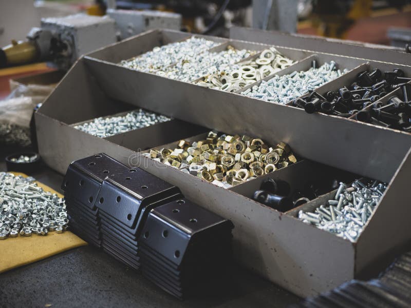 Different Types of Fasteners on the Worker`s Table. Work Place at the ...