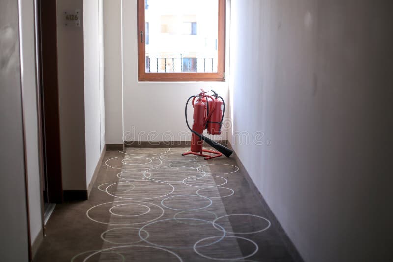 Different Types of Fire Extinguishers on the Hallway of a Hotel Stock ...